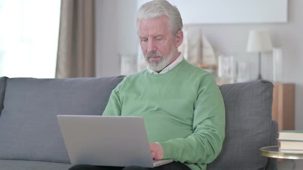 Old Man with Laptop Smiling at the Camera, Stock Footage | VideoHive