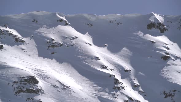 Snow Eaves and Sastrugi Accumulated on Mountain Ridge, Stock Footage