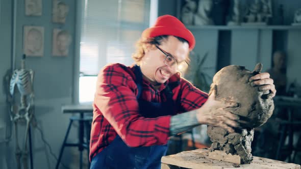 Artist is Smashing a Clay Head in Anger, Stock Footage | VideoHive