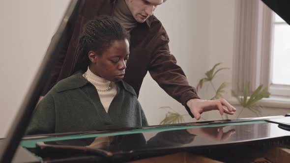 Young Black Woman at Piano Lesson, Stock Footage | VideoHive