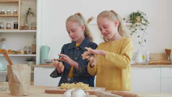 Twin Sisters Cooking in Kitchen, Stock Footage | VideoHive