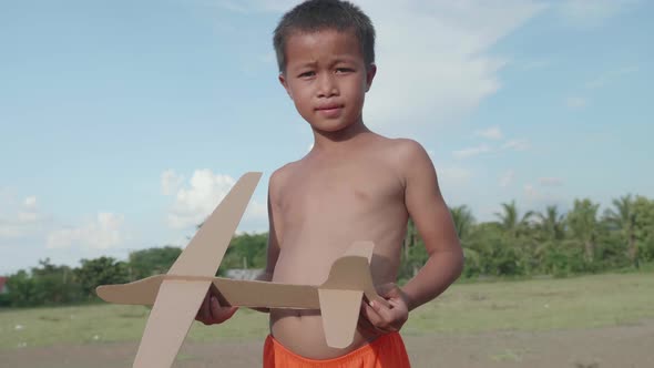 Poor Kid Holding Toy Airplane , Stock Footage | VideoHive