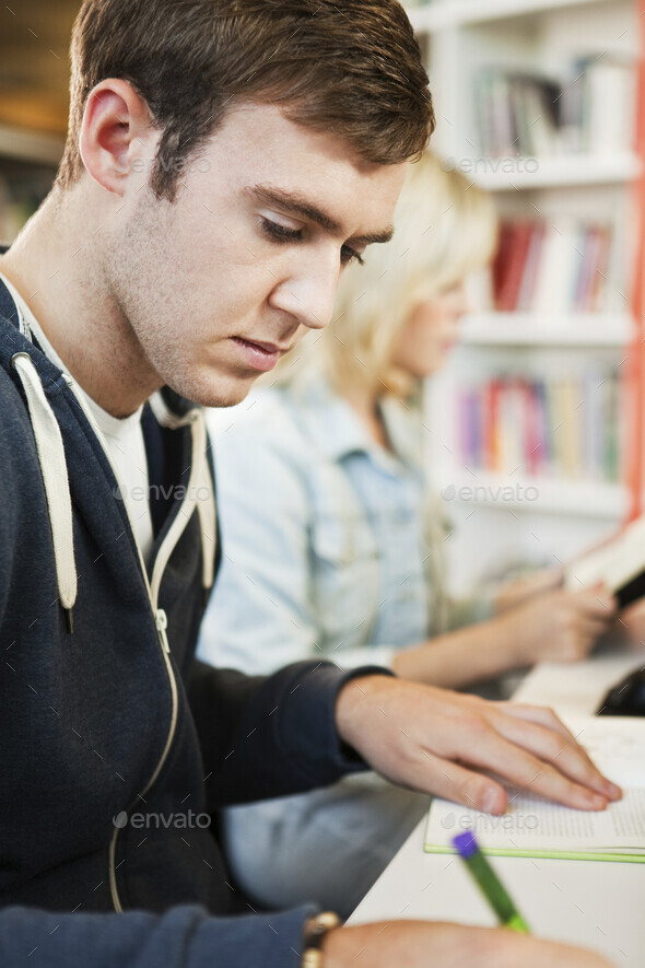 University students in college library Stock Photo by Image-Source