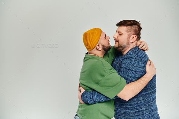 Embracing Love: Two Men Sharing a Heartfelt Hug Stock Photo by ...