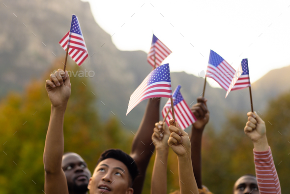 Happy diverse friends raising flags of usa in garden Stock Photo by ...