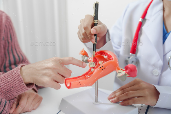 female doctor reassuring patient with comforting hand gesture, with ...