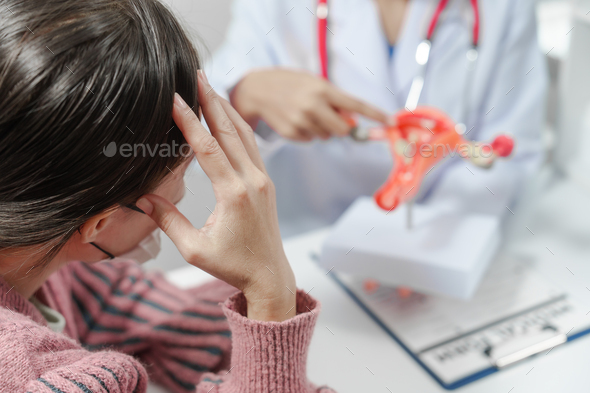 female doctor reassuring patient with comforting hand gesture, with ...
