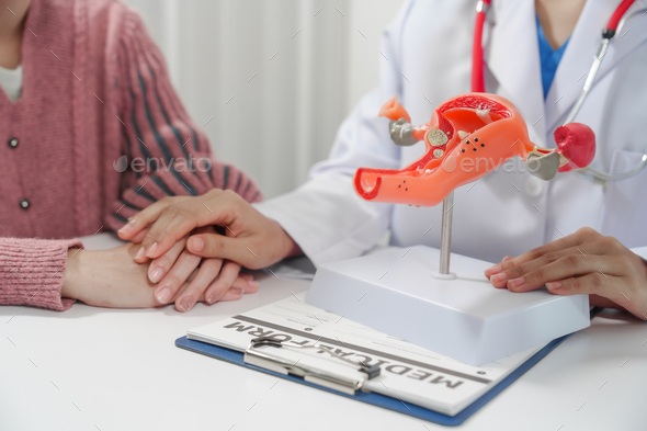 female doctor reassuring patient with comforting hand gesture, with ...