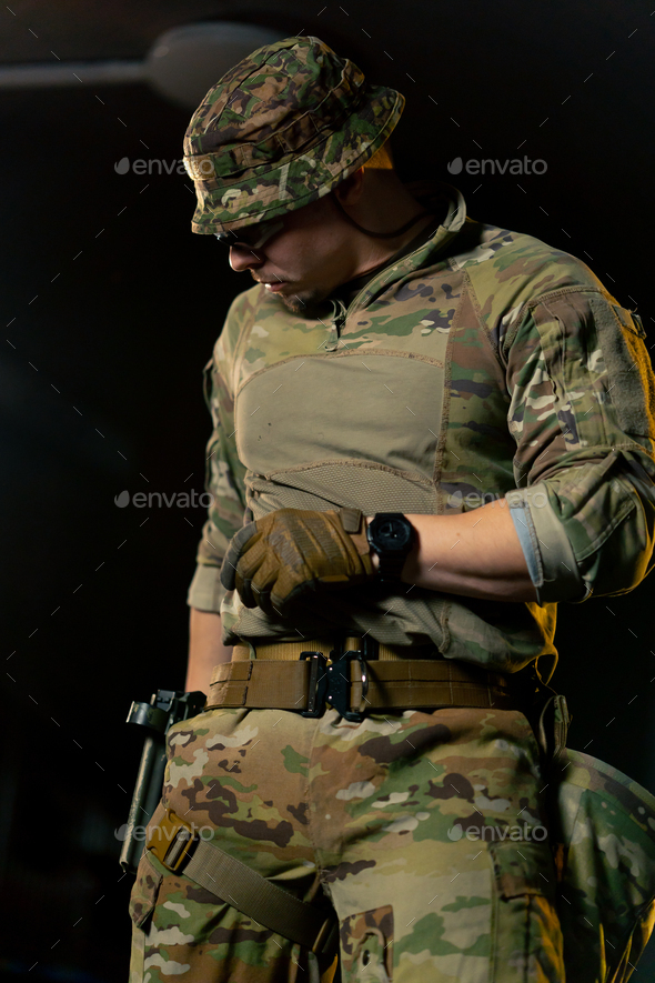 close-up at a professional shooting range a military trainer reloading ...