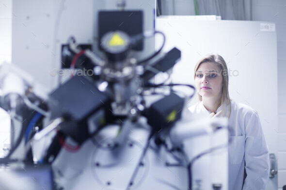 Female scientist using scanning electron microscope in lab Stock Photo ...