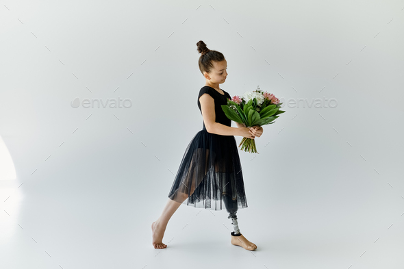 Young Gymnast With Prosthetic Leg Holds Flowers Stock Photo by ...