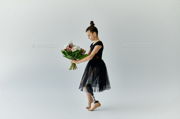 Young Gymnast With Prosthetic Leg Holds Flowers Stock Photo by ...