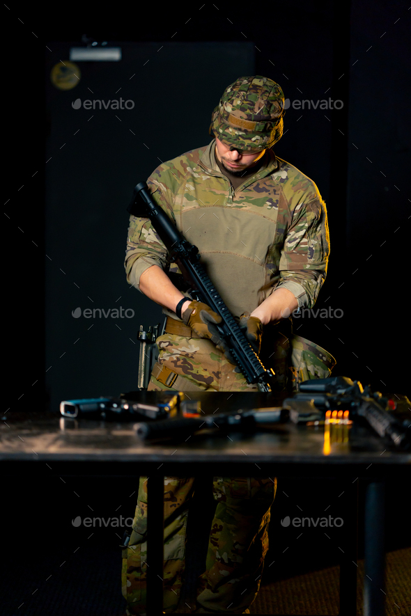 in a professional shooting range professional fighter assembles a NATO ...