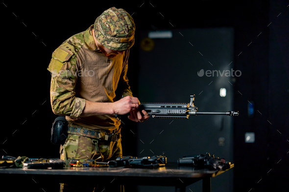 in a professional shooting range professional fighter assembles a NATO ...