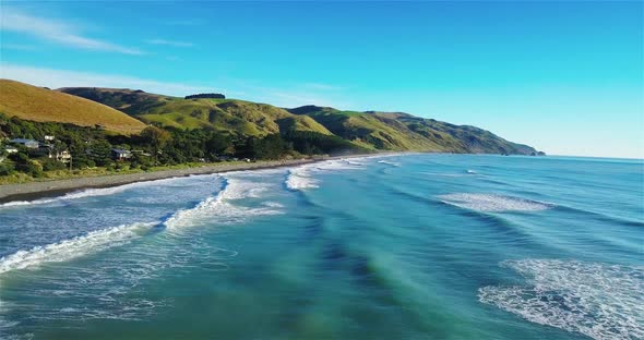 Drone View of the Beach of Gore Bay, New Zealand, with Green Farmland ...