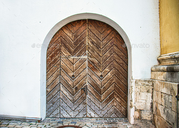 antique wooden double-leaf gate of a medieval fortress Stock Photo by ...