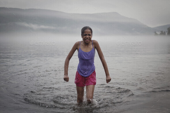 Cold girl getting out of water on summer vacation at Lake George, New ...