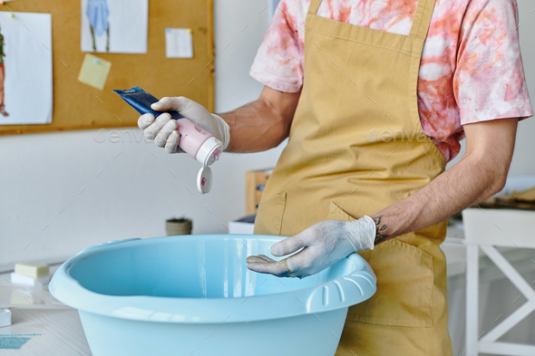 The dyeing artist: a diy clothing restoration atelier Stock Photo by ...