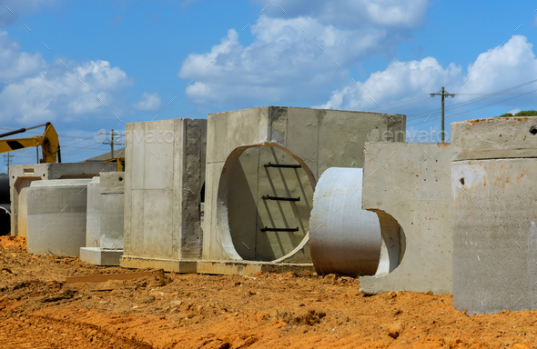 Stack of concrete drainage wells for water discharge in a construction ...