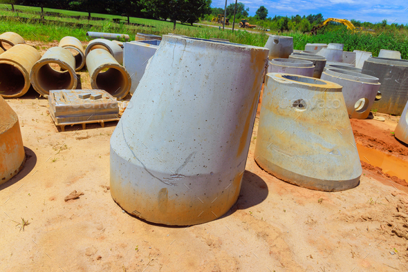 Stack of concrete drainage wells for water discharges in a construction ...