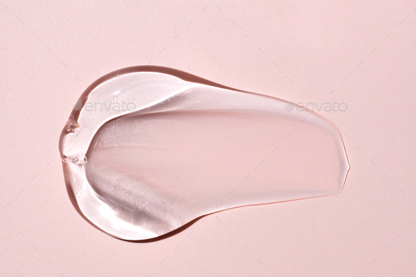 Glycerin gel texture smear. Transparent serum swatch on beige ...