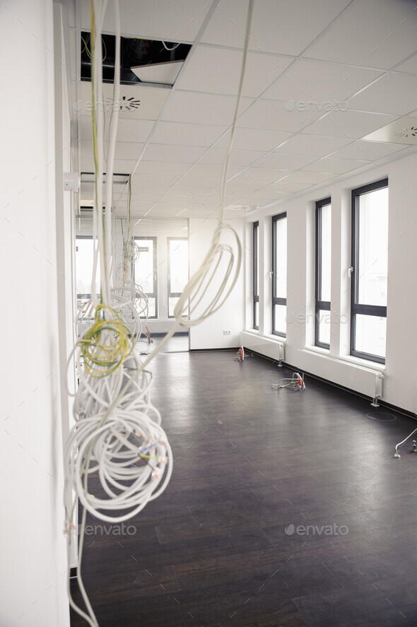Network and power cables hanging from new office ceiling Stock Photo by ...