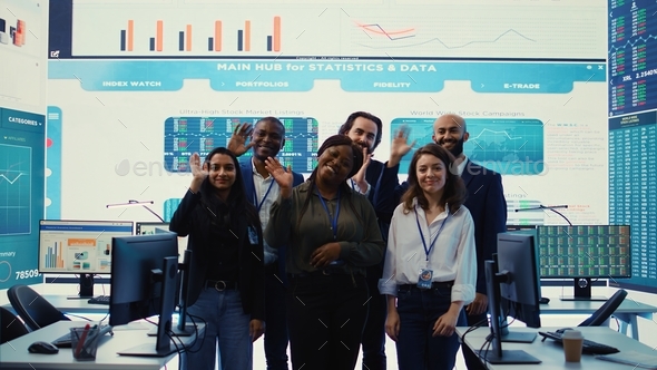 Confident smiling enterprise team uniting their forces to improve ...