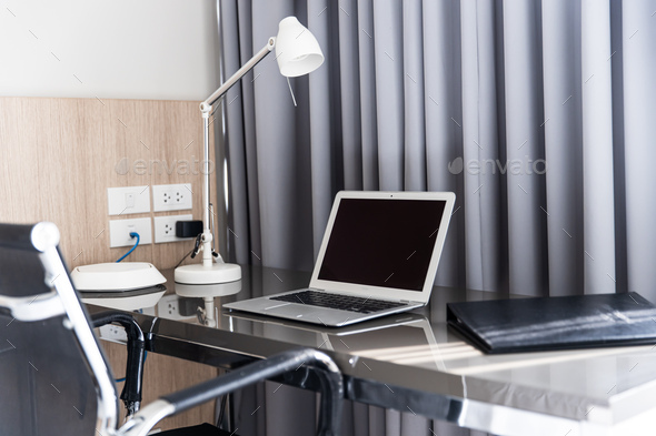 Home office interior desk with laptop computer Modern cozy work space. Business working decorated Stock Photo by coffeekai