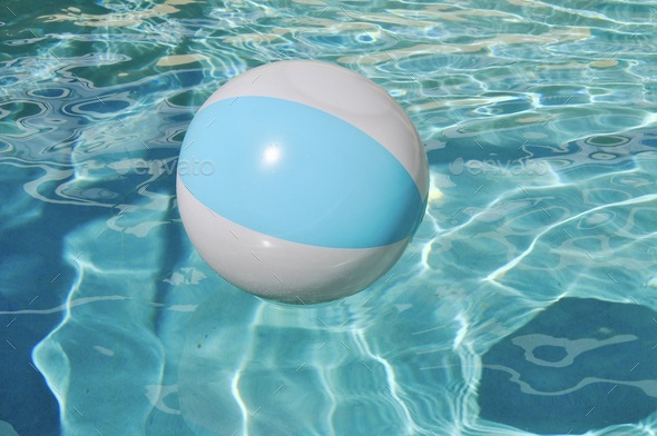 Ball floating in the pool. Stock Photo by marisap7 | PhotoDune