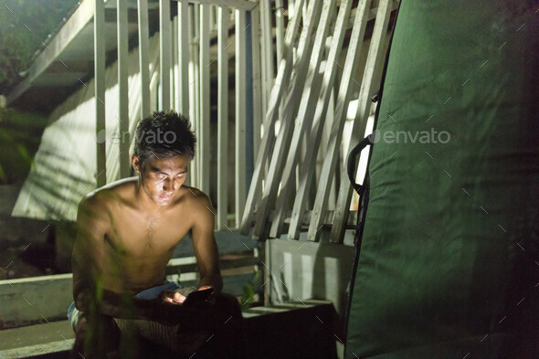 Man texting by wooden building, Abulug, Cagayan, Philippines Stock ...
