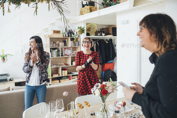Friends clapping hands at celebration in loft office Stock Photo by ...