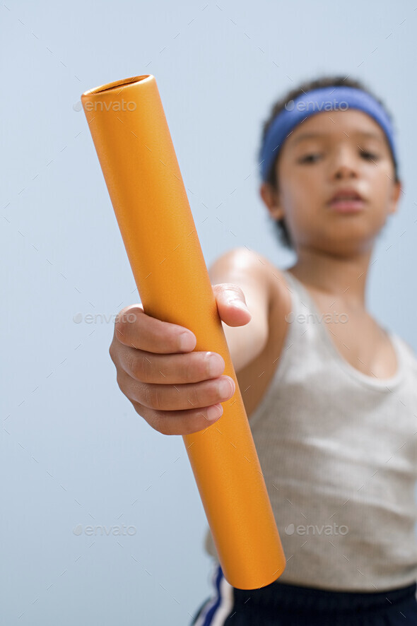 Boy passing relay baton Stock Photo by Image-Source | PhotoDune