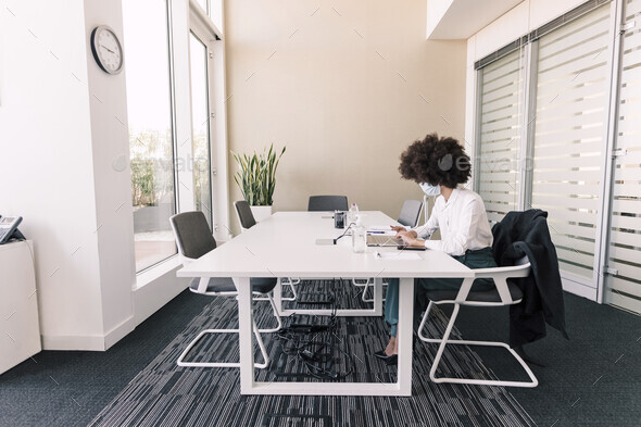 Professional woman focused on work in a modern office setting. Stock ...