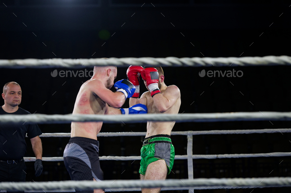 Fierce boxing match showcases athletes' power and skill. Stock Photo by ...