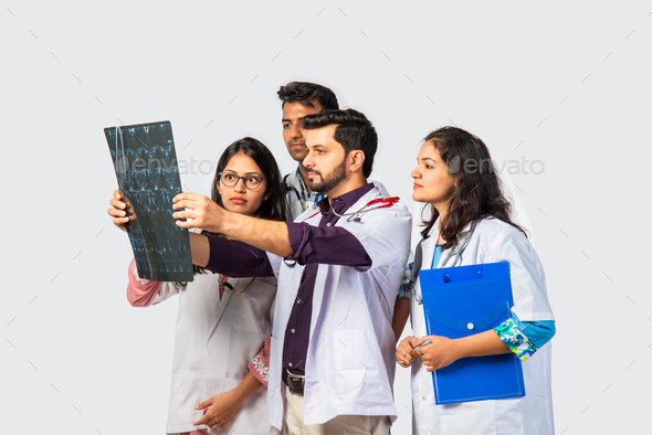 Indian team of young doctors checking MRI scan or xray Stock Photo by ...