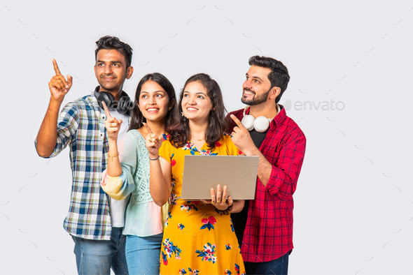 Indian asian college students using laptop isolated against white ...