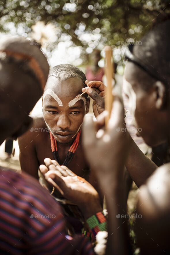 Traditional face painting in an outdoor setting Stock Photo by Image-Source
