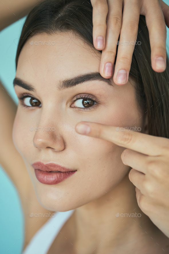 Eye Care And Vision. Woman Demonstrating Contact Lens Application on ...