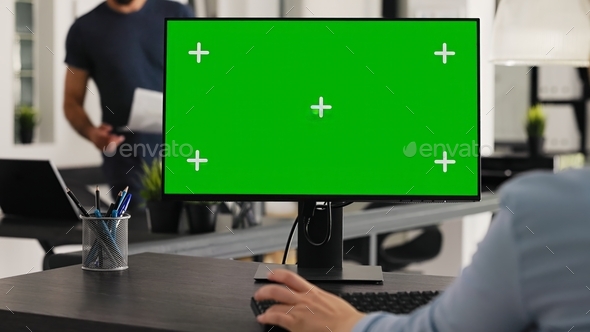 Worker at desk with greenscreen desktop Stock Photo by DC_Studio ...