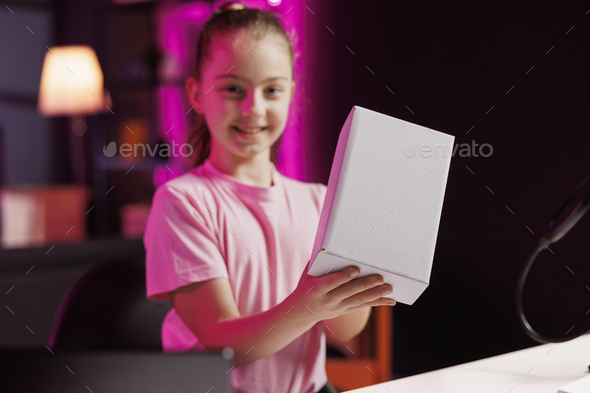 Portrait of kid content creator using high quality recording gear to ...