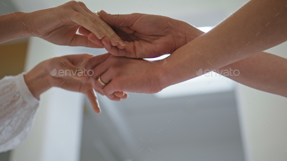 Closeup couple hands separating indoors. Gentle female arms touching ...