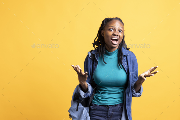 Portrait of girl feeling outraged, being hysteric, studio background ...