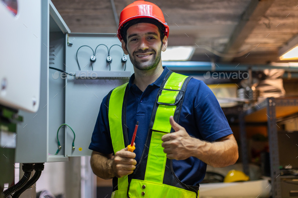 Electrical engineer working in control room. Stock Photo by kckate16