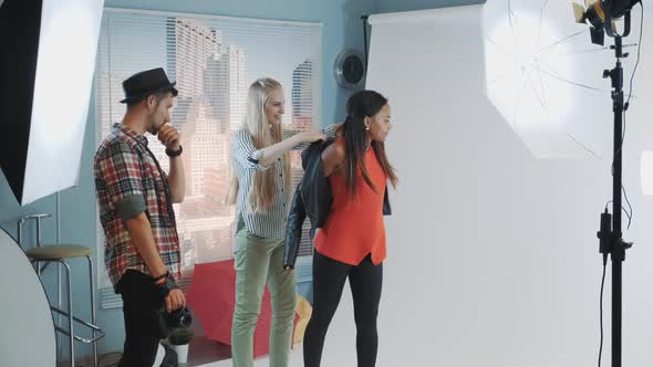 Young Black Model Changing Clothes and Posing for a Photographer, Stock ...