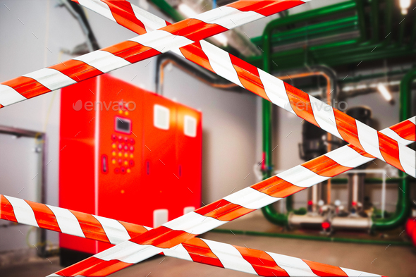 Unsafe industrial area from warning red white lines barrier. Production ...