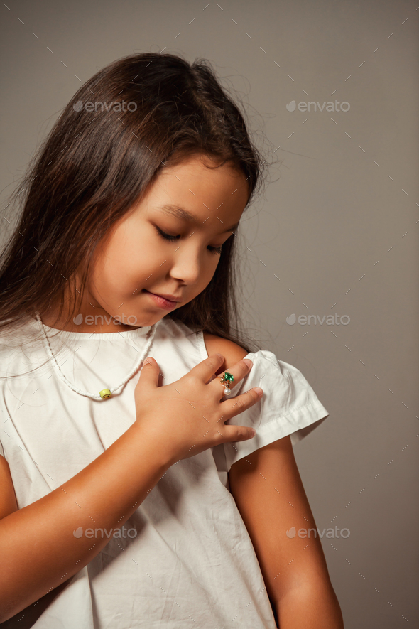 Perfect asian child cover girl 7-8 year old posing with ring on finger ...
