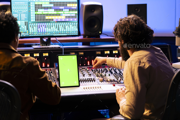 Singer and audio expert working with isolated screen on gadget Stock ...