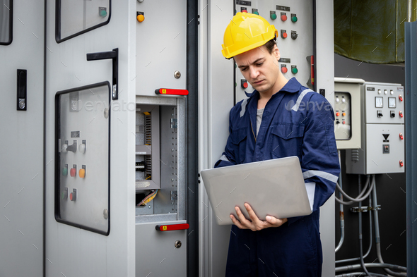 Electrical engineer working in control room. Stock Photo by kckate16