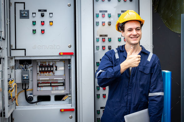 Electrical engineer working in control room Stock Photo by kckate16