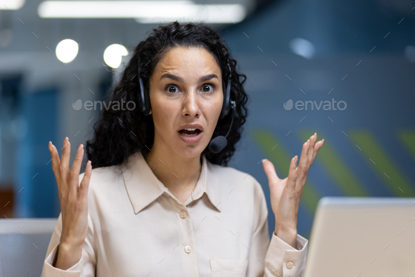 Frustrated call center agent expressing emotions during work with ...